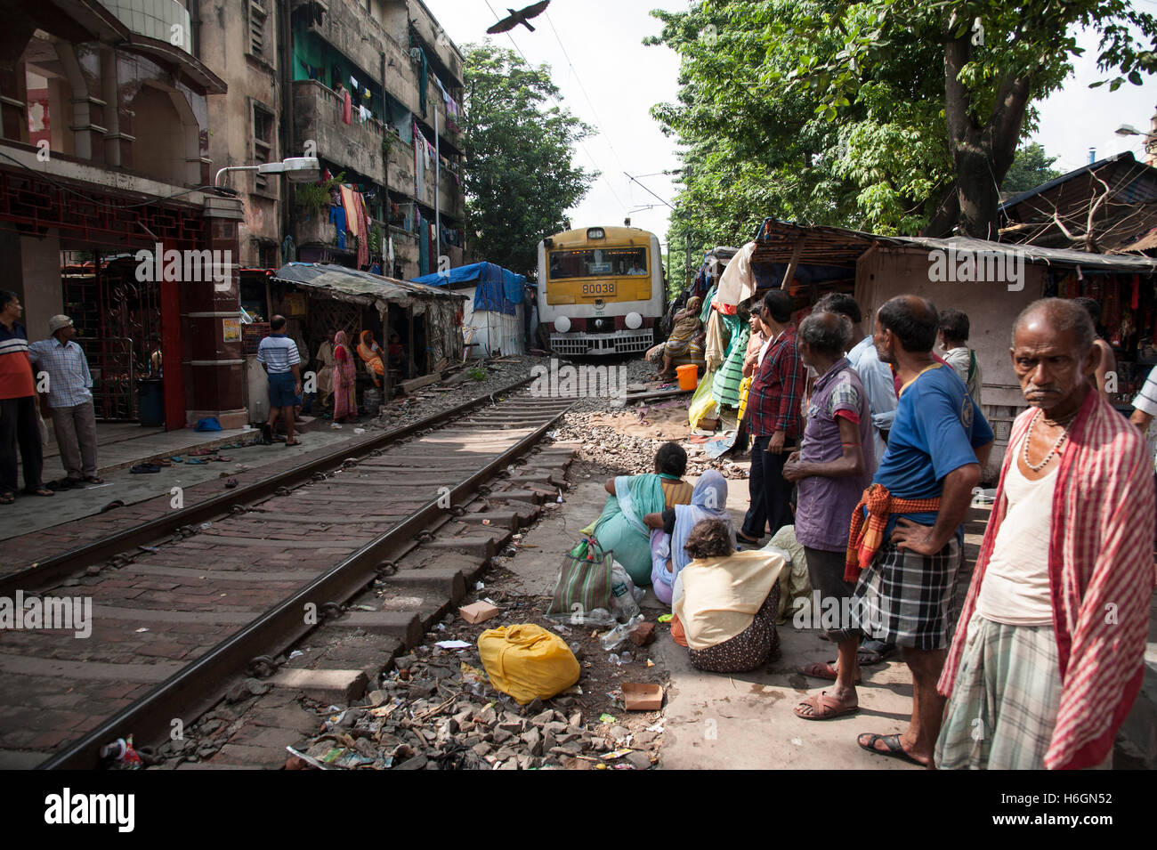 Slum people alongside the railway line Kolkata local train Kolkata West ...