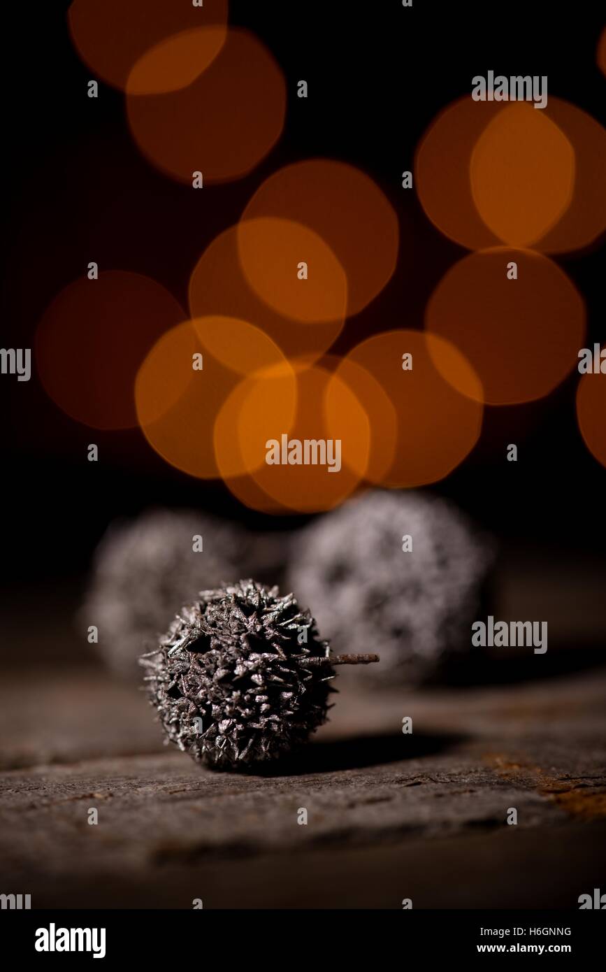 Dark vertical photo of decorative prickly grey balls placed on old ...