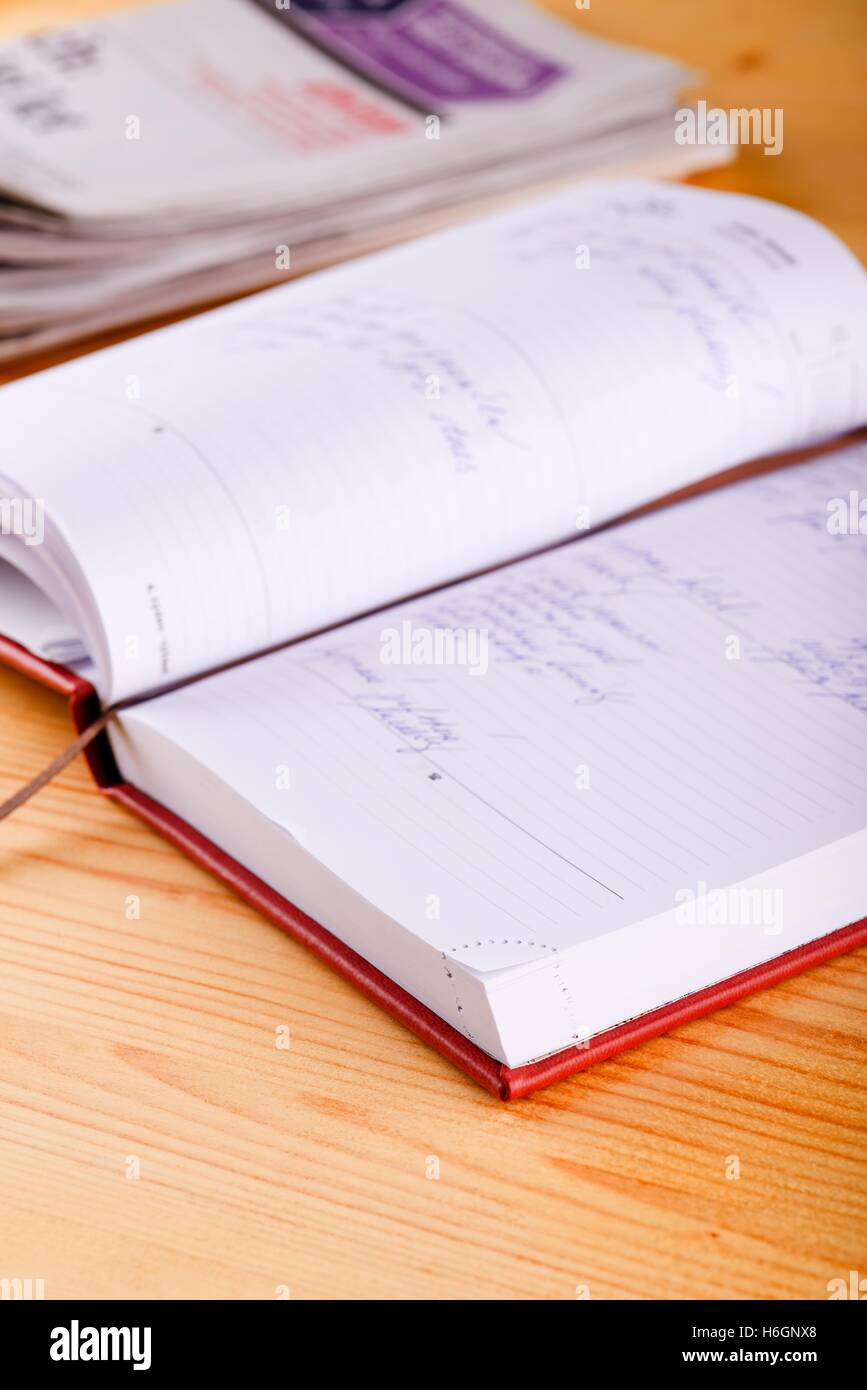 Vertical photo of opened diary with hand writing which is placed on ...