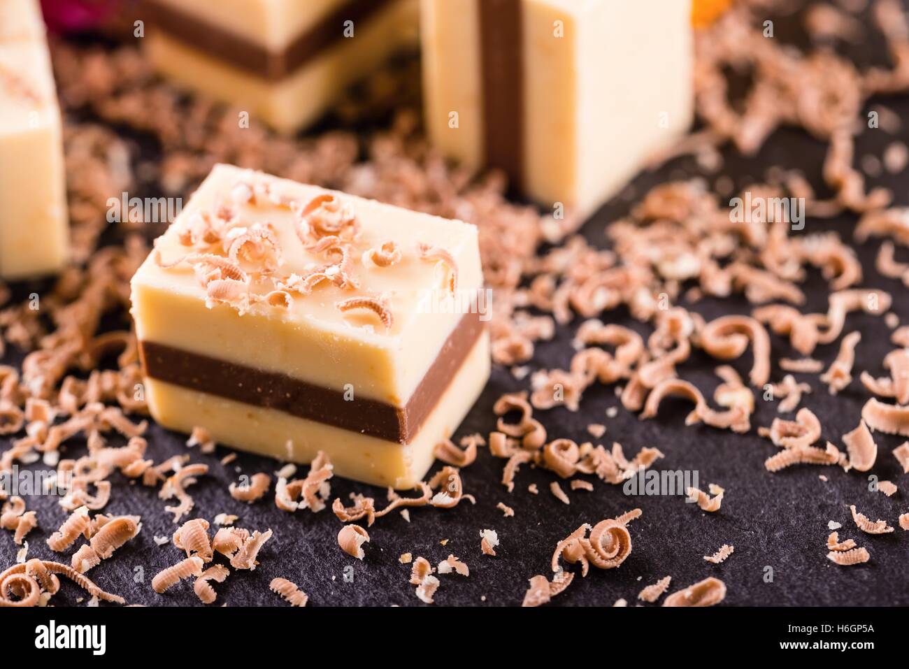 Horizontal photo of several chocolate nougat cubes made from three ...
