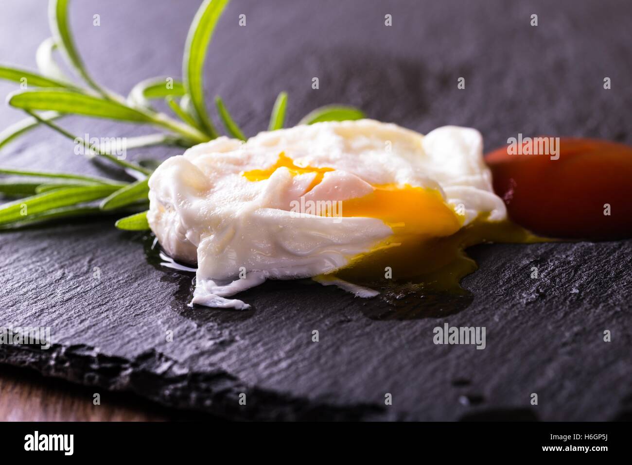 Horizontal photo of single pouched egg with few water bubbles on ...