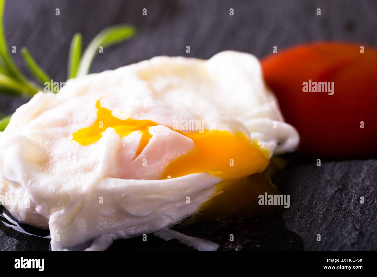 Horizontal photo of single pouched egg with few water bubbles on ...