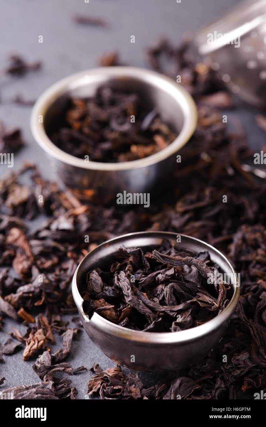 Vertical photo of metal tea strainer which is divided to two three ...