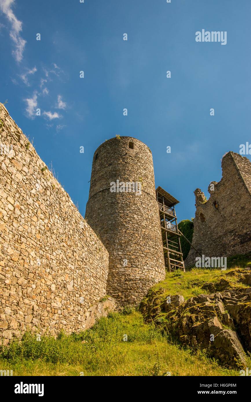 Vertical photo of very old medieval tower of damaged castle. Only ruins ...