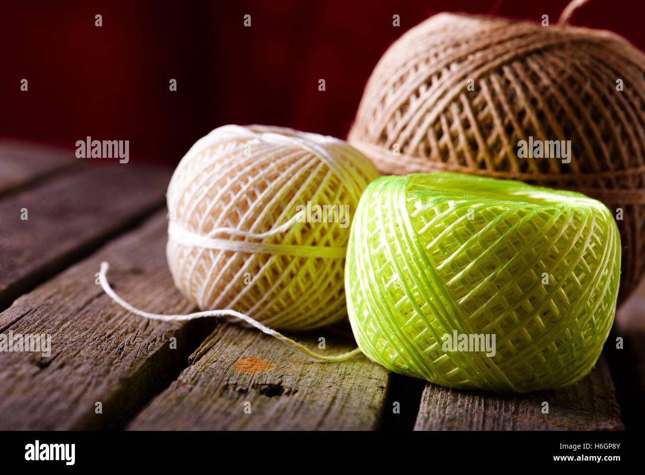 Horizontal photo of three clues of cord with different colors. The view ...
