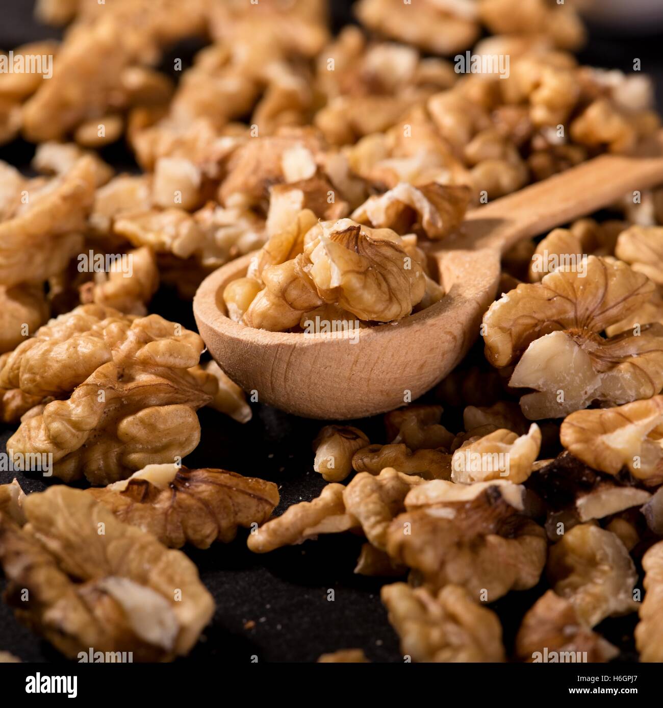 Wooden spoon full walnuts hi-res stock photography and images - Alamy