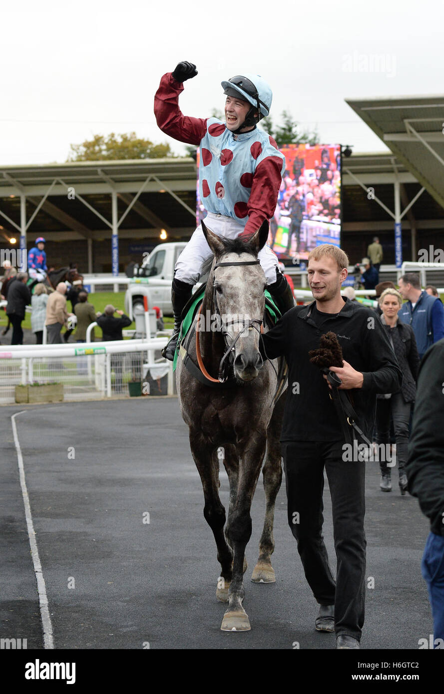 Jockey Jonathan Moore celebrates after riding Irish Cavalier to victory ...