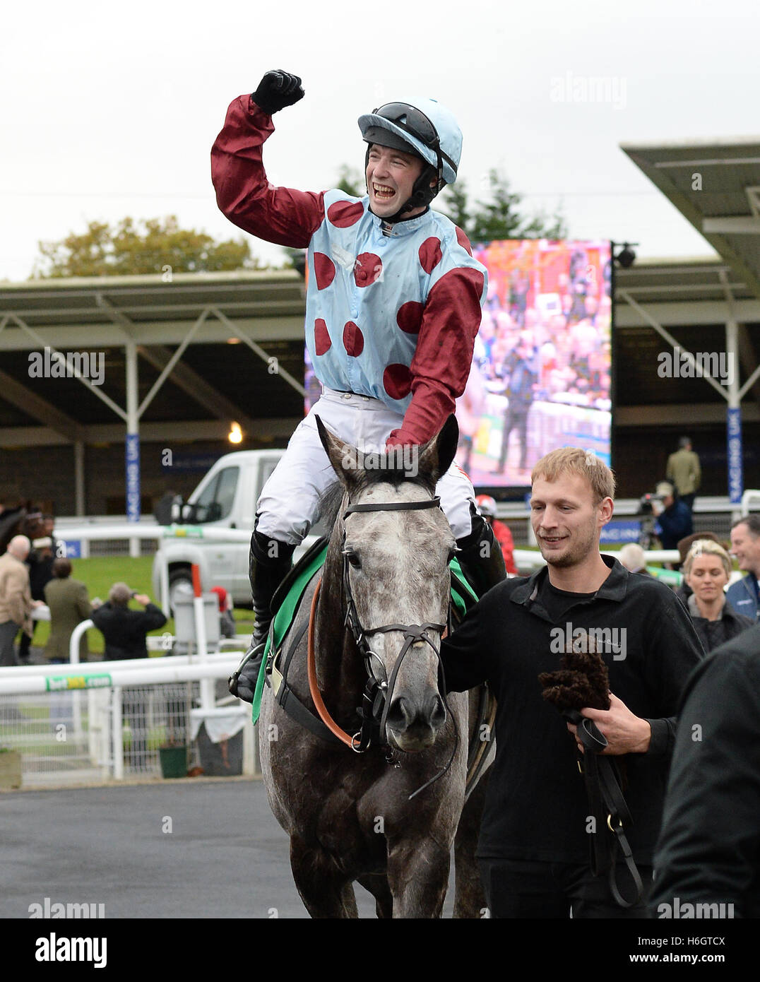 Jockey Jonathan Moore celebrates after riding Irish Cavalier to win the ...