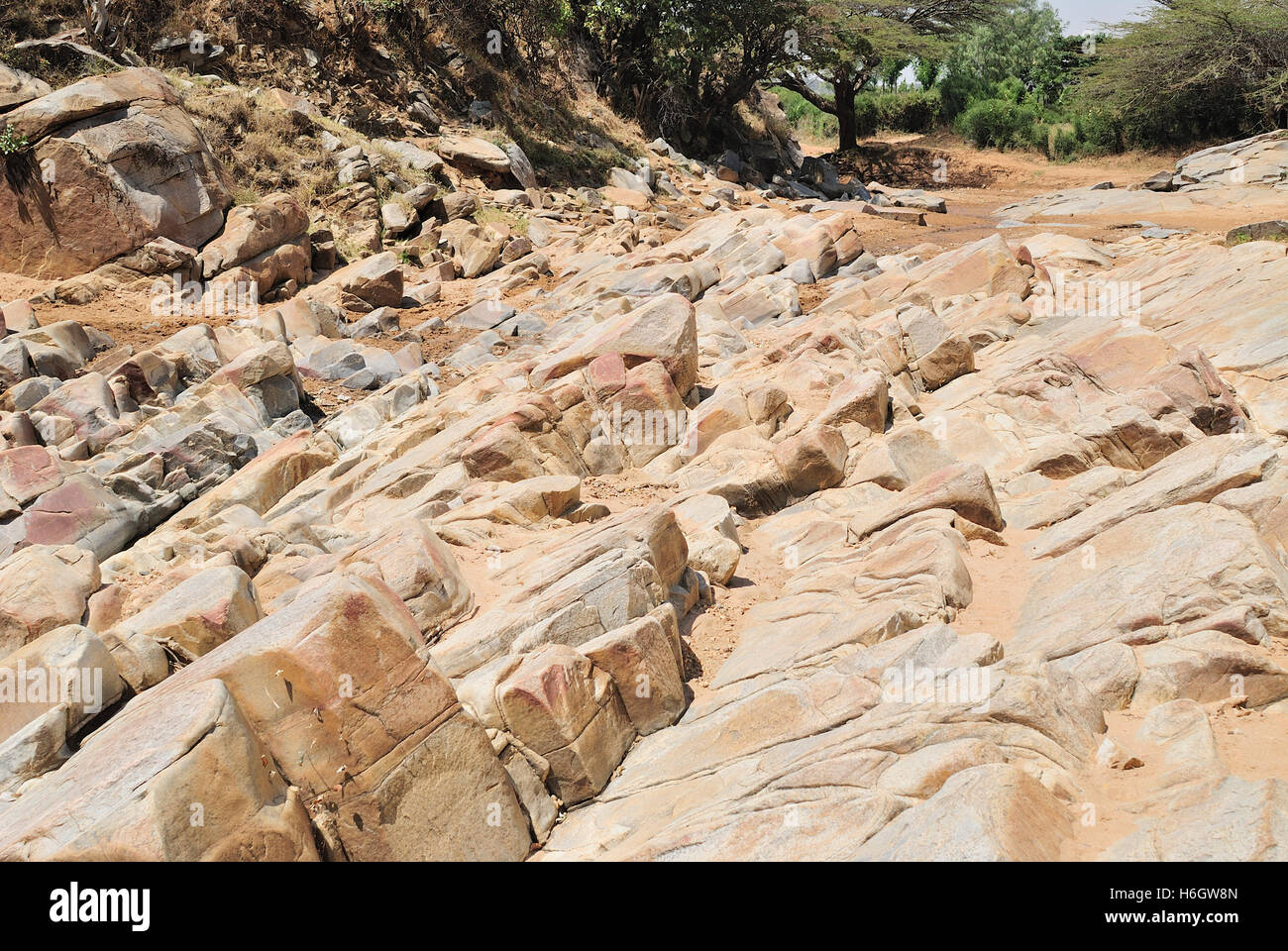 Weathered rock formation within an African seasonal dry riverbed Stock ...