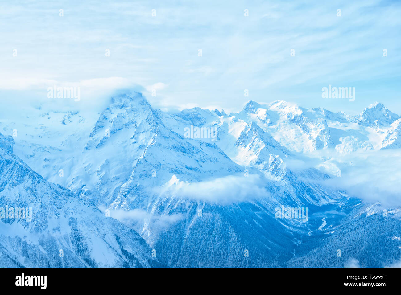 amazing view of winter day landscape Dombaj mountains with blue sky ...