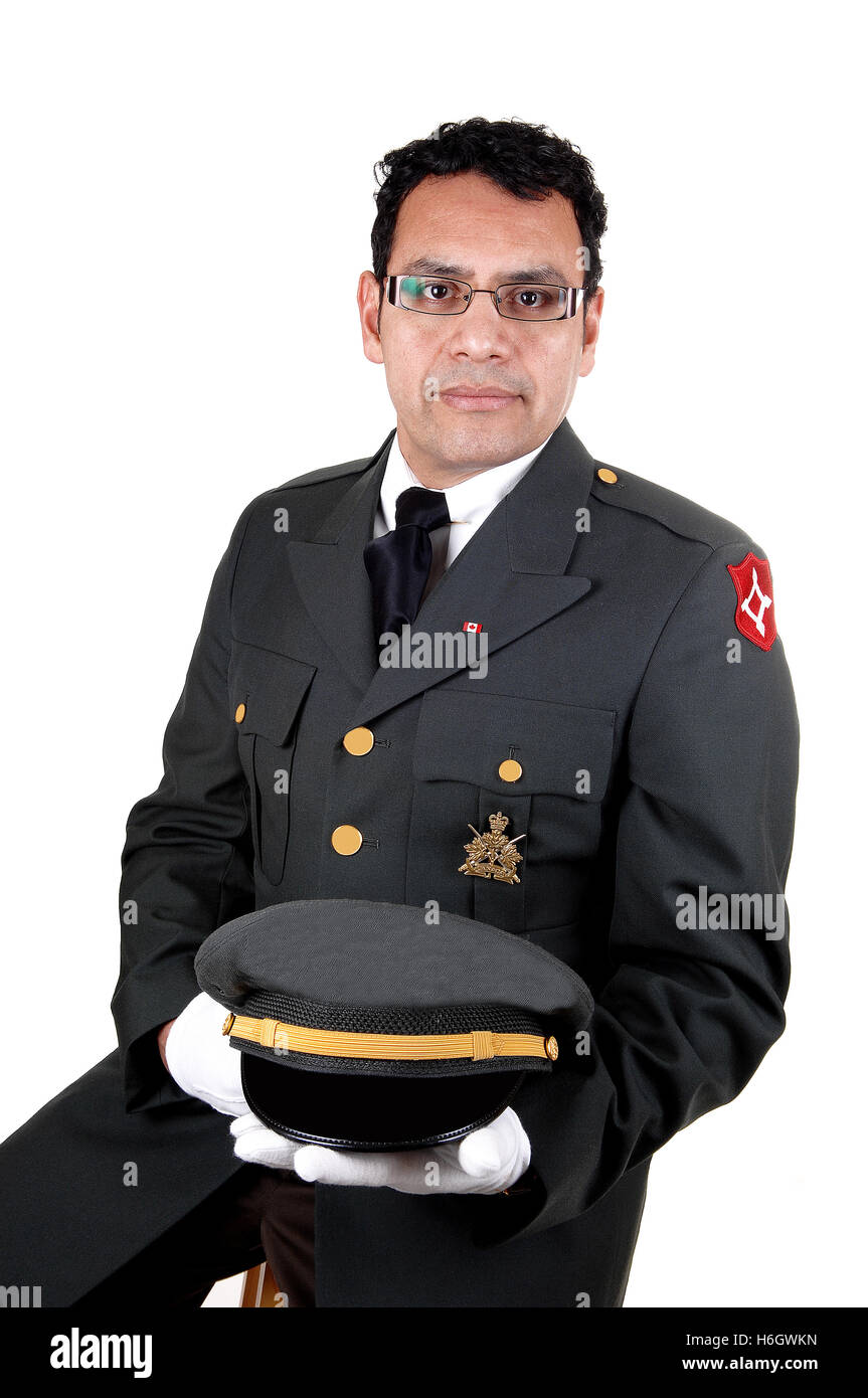 The portrait of a security guard sitting and holding his cap with white ...