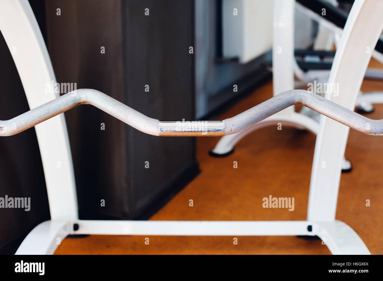 Bar-bell in the gym Stock Photo - Alamy