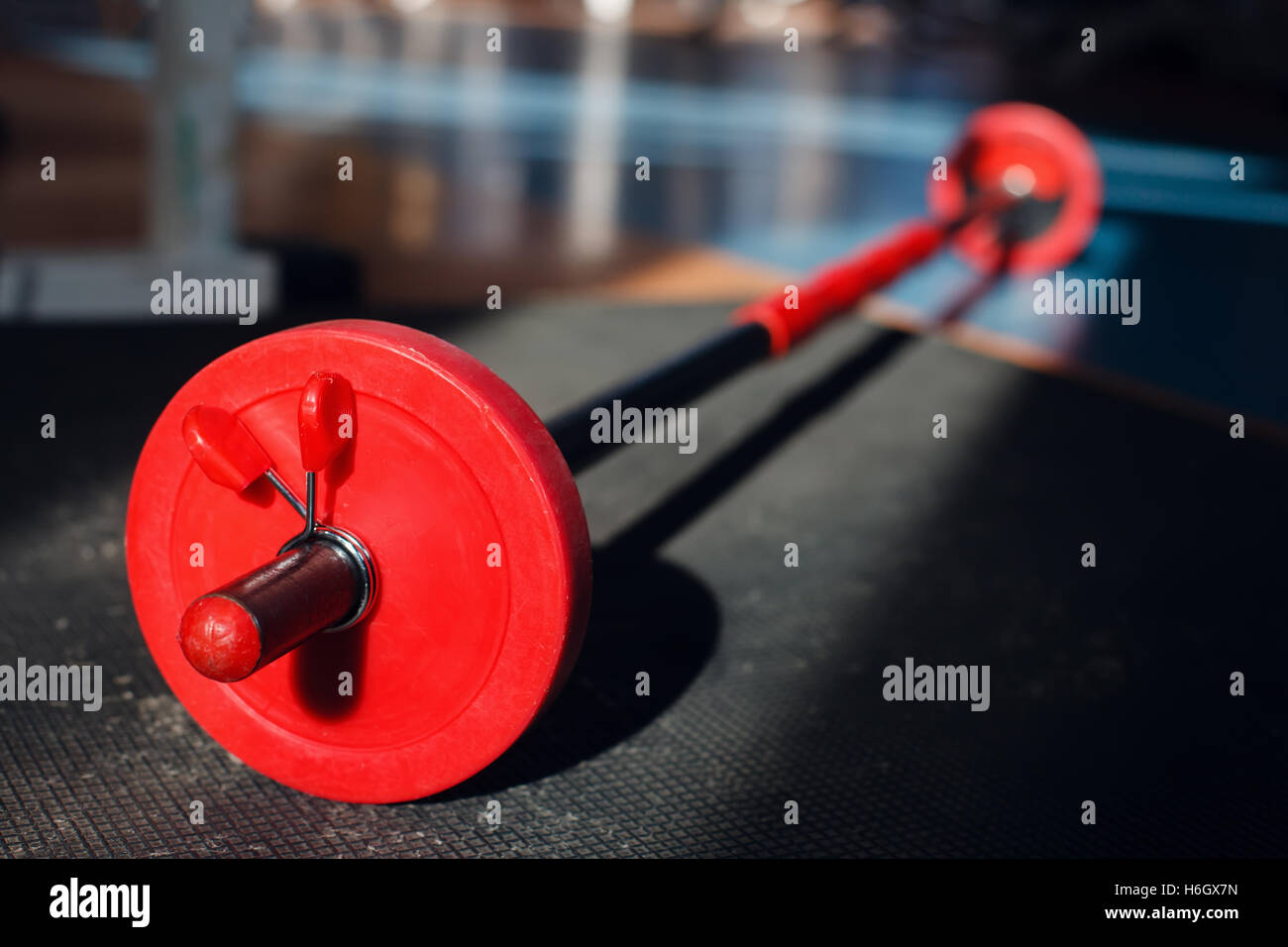 Bar-bell in the gym Stock Photo - Alamy