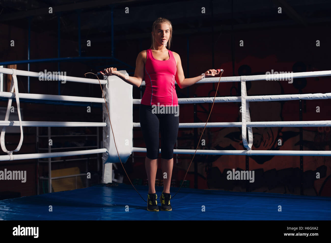 Woman with jumping rope Stock Photo - Alamy
