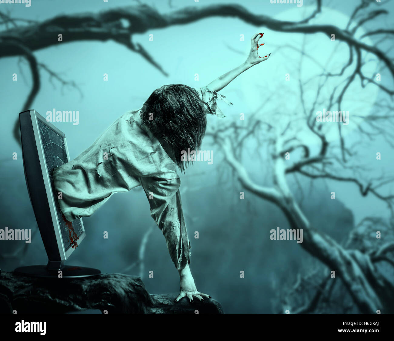 The corpse woman gets out of the computer monitor Stock Photo - Alamy