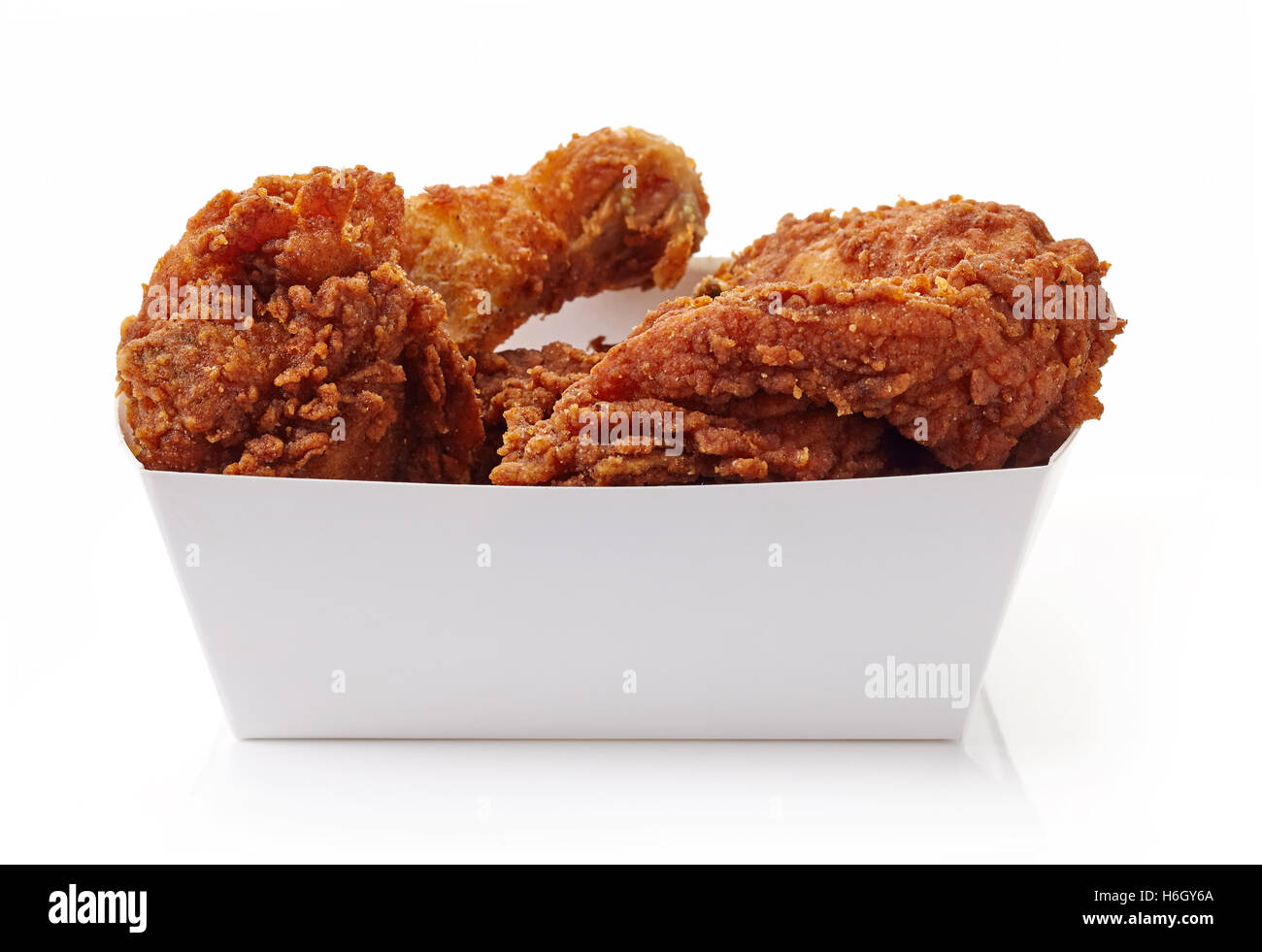 Fried breaded chicken in white cardboard box isolated on white ...