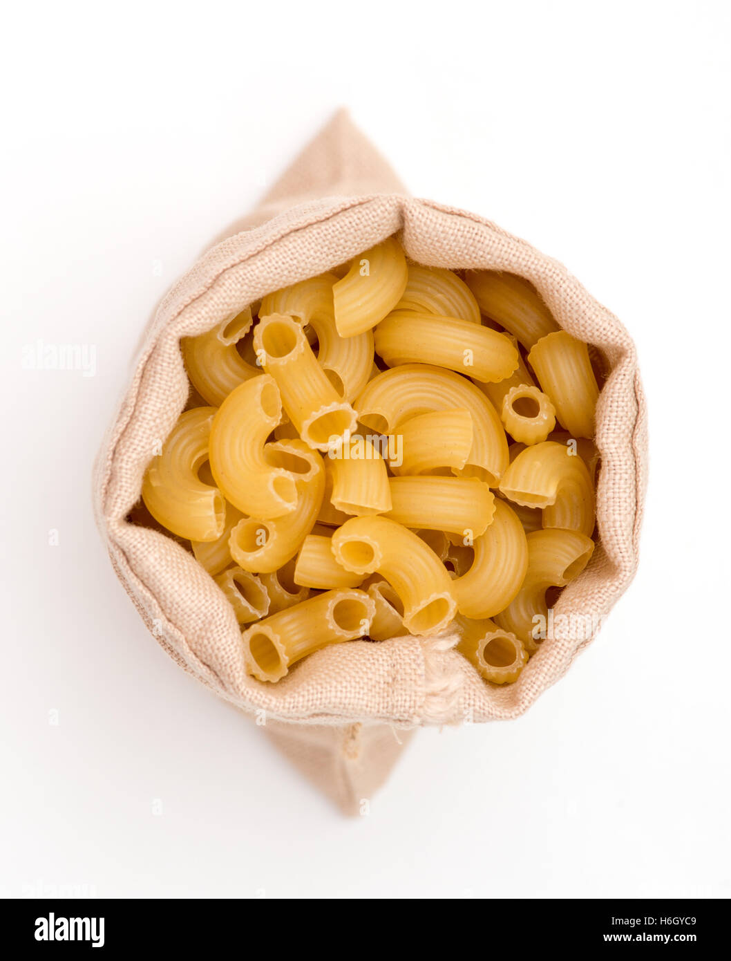 plenty of raw pasta in bag on white background Stock Photo - Alamy
