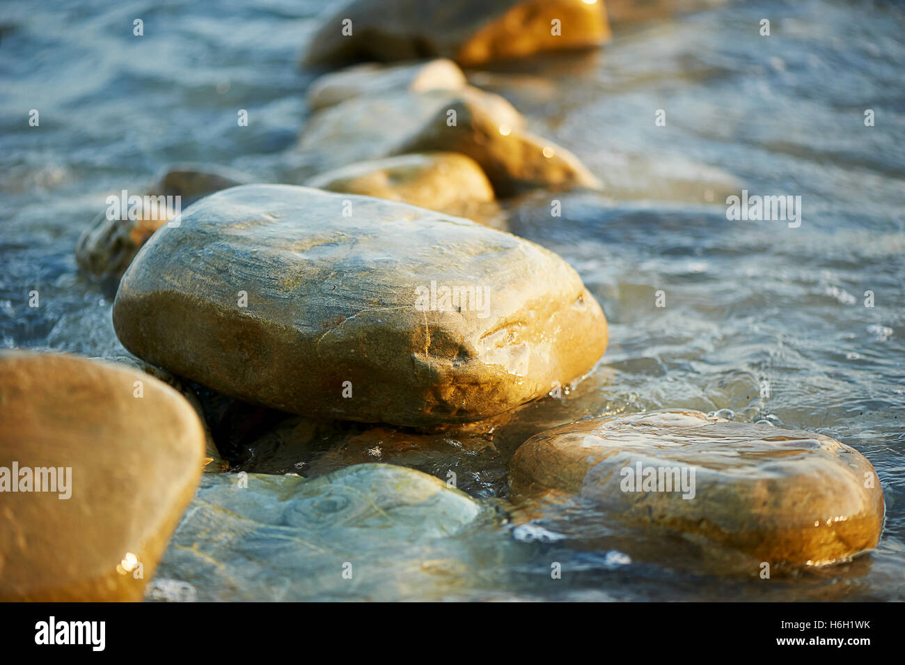 Wet sea rocks, washed by the waves. Close Stock Photo - Alamy