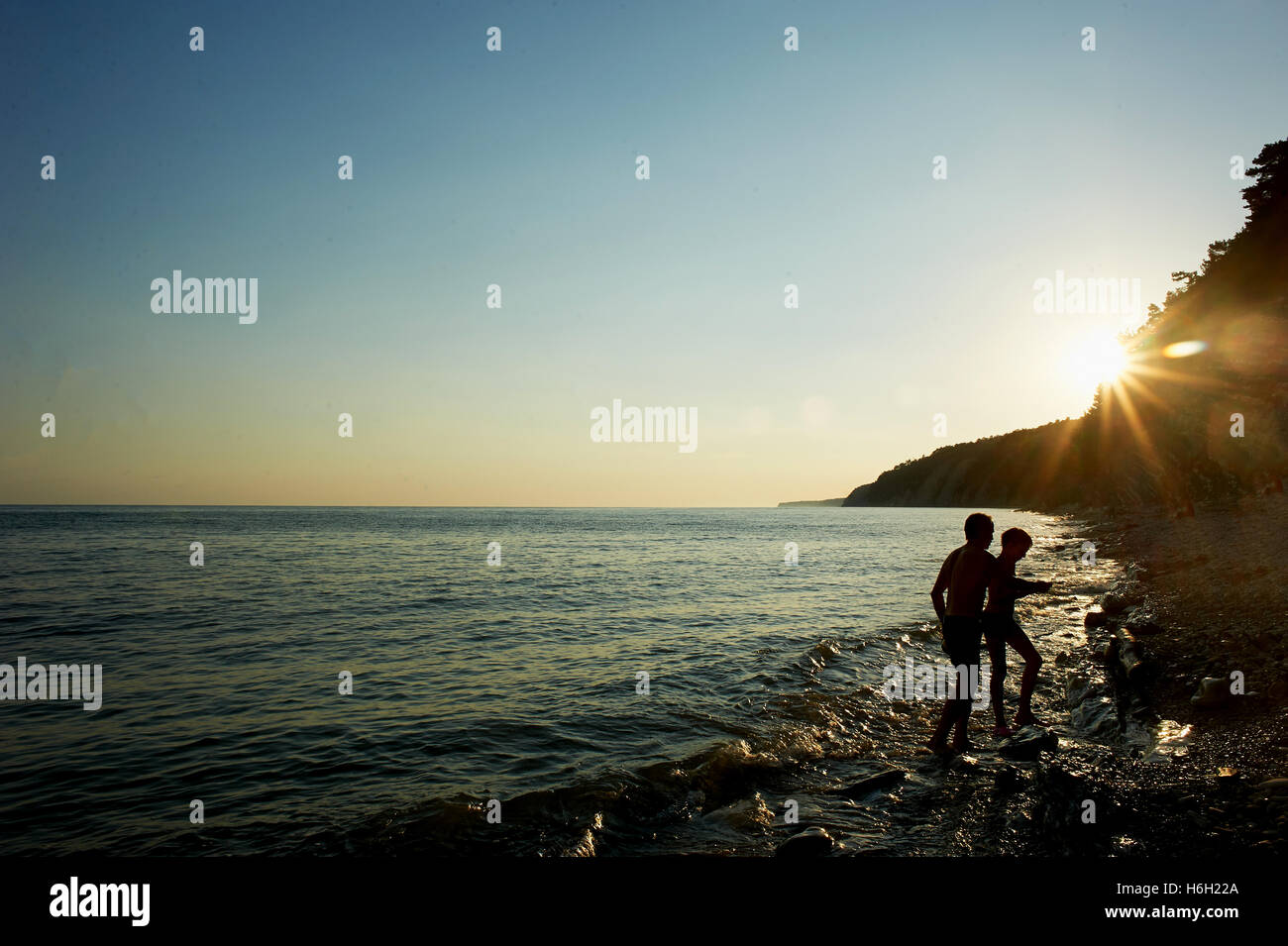 Wet sea rocks, washed by the waves Stock Photo - Alamy