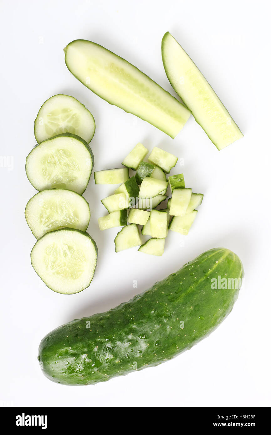 Slicied and diced cucumbers. Isolated on a white background. Directly ...