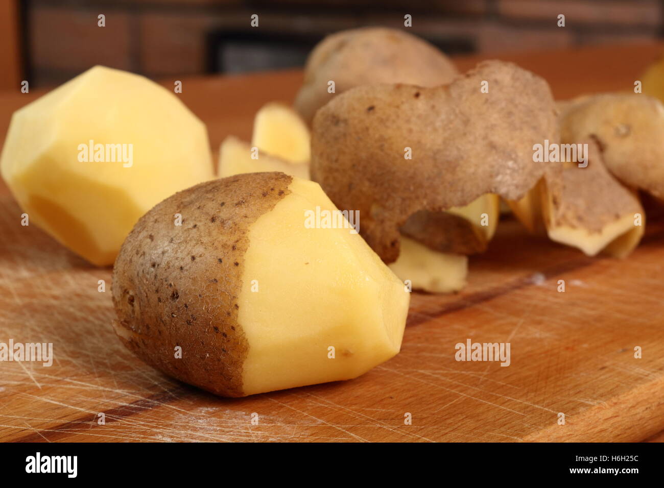 Half peeled potatoes Stock Photo - Alamy