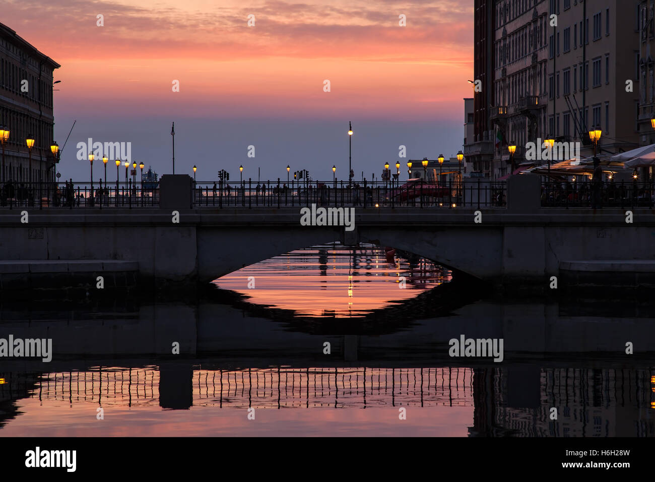 View of Ponte rosso in Trieste at sunset, Italy Stock Photo - Alamy