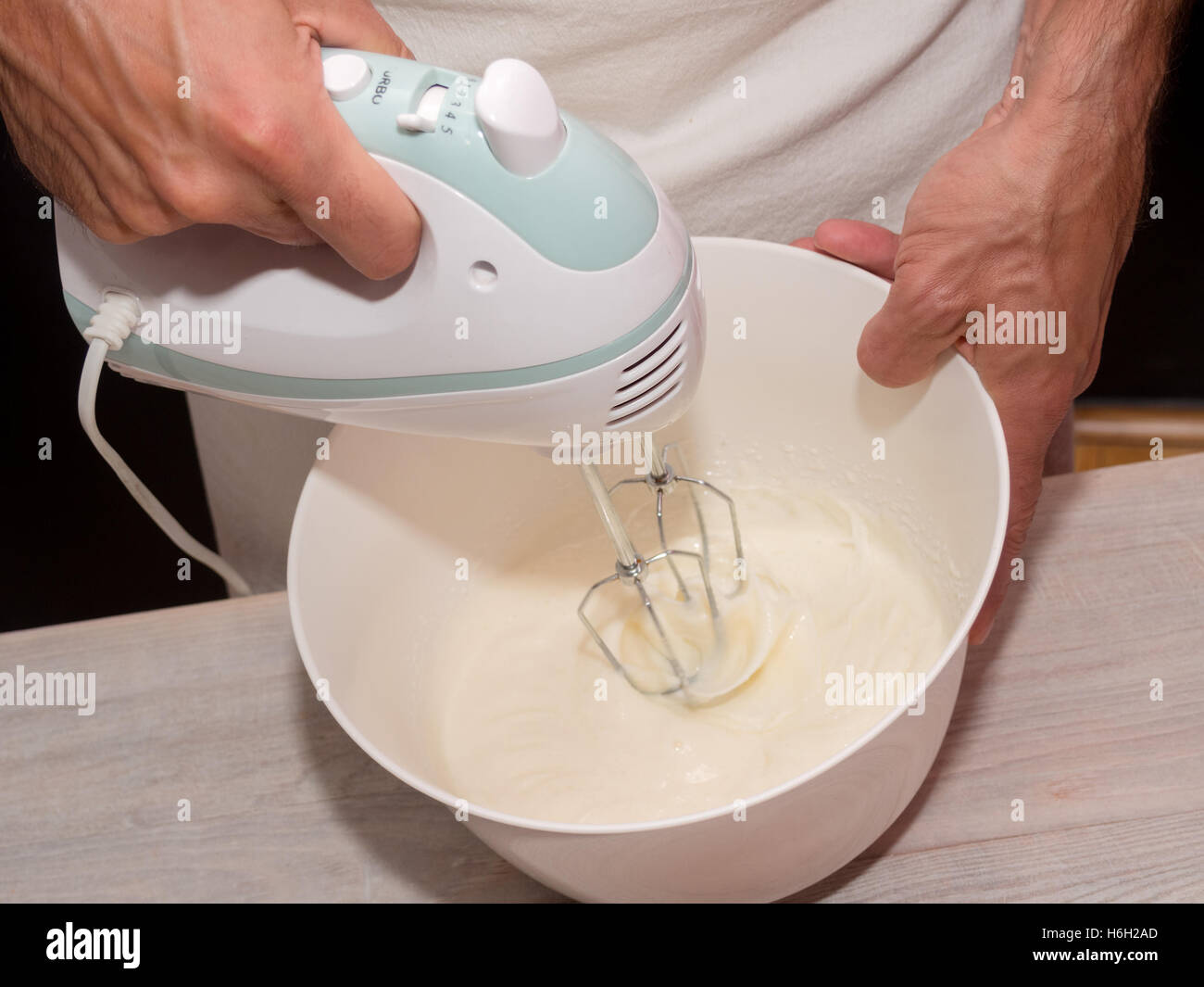 Hand mixer beating batter cake hi-res stock photography and images - Alamy