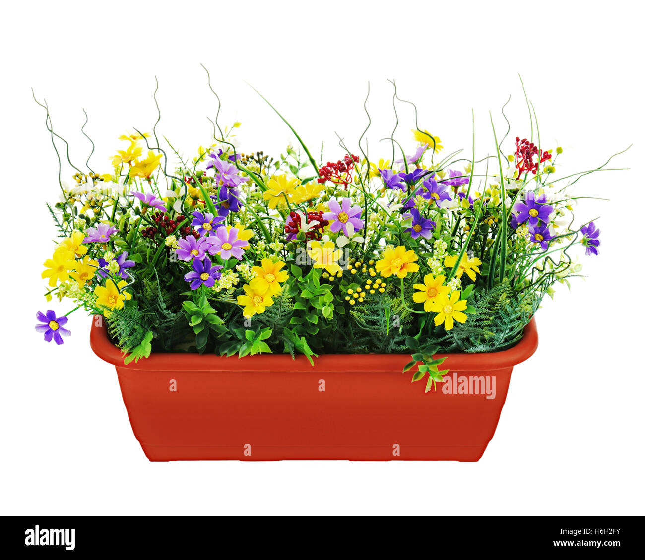 Composition of artificial garden flowers in decorative flowerpot ...