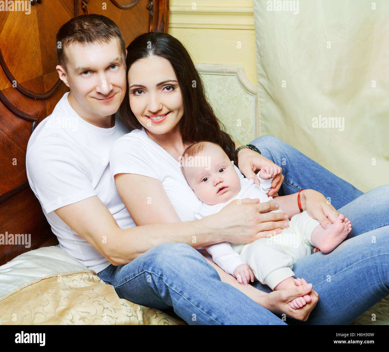 happy family, mother , father and son in the studio Stock Photo - Alamy