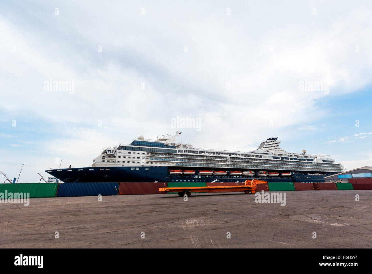 A passenger ship docking in a commercial port Stock Photo - Alamy
