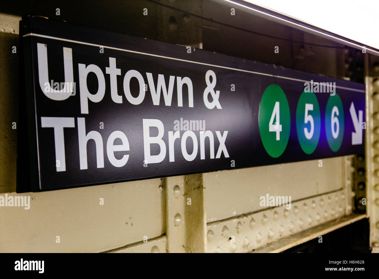 Sign in a New-York subway station marking the way to Uptown & The ...
