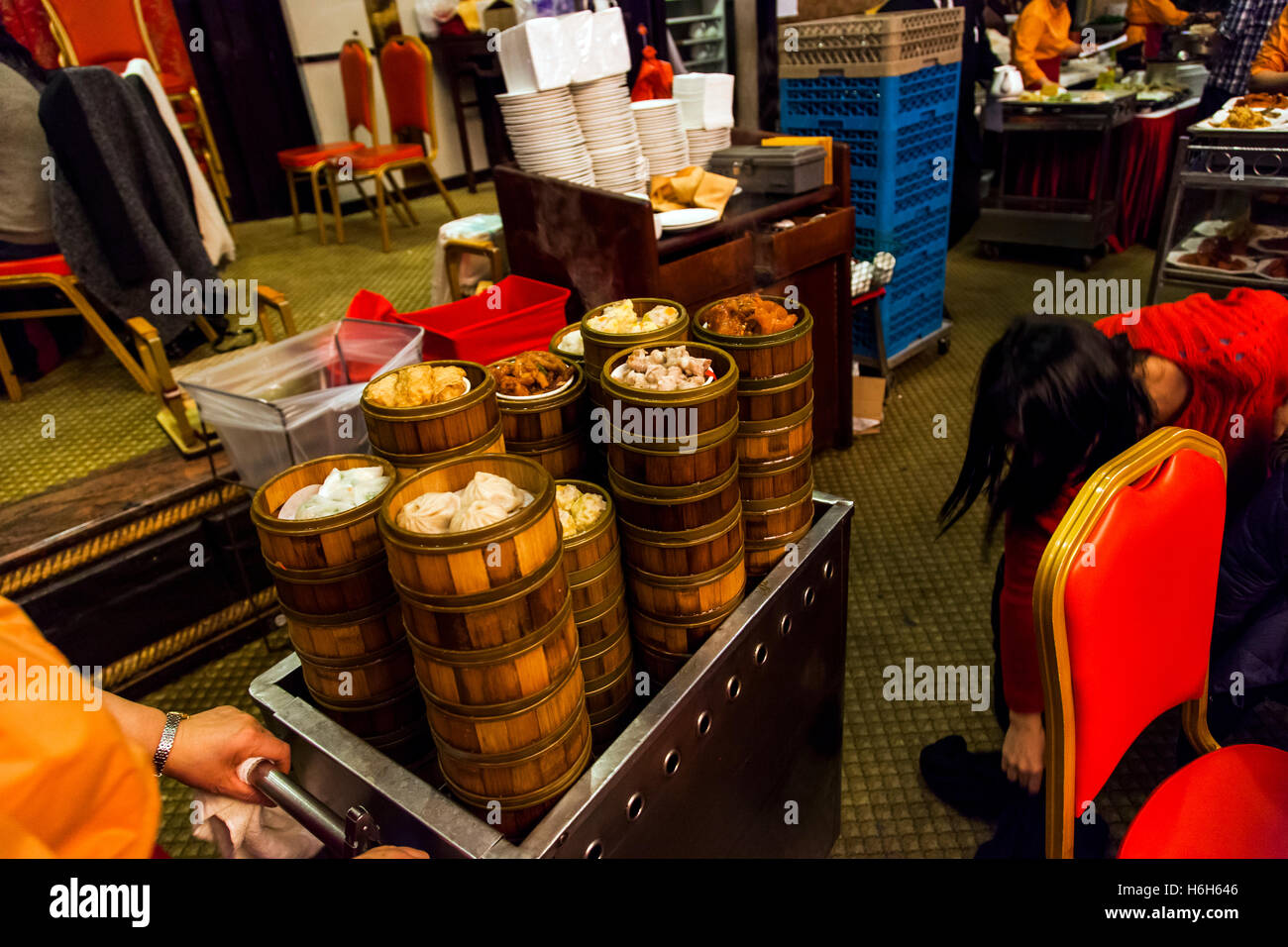 Stacks of Chinese food dishes on a cart in a traditional Chinese ...