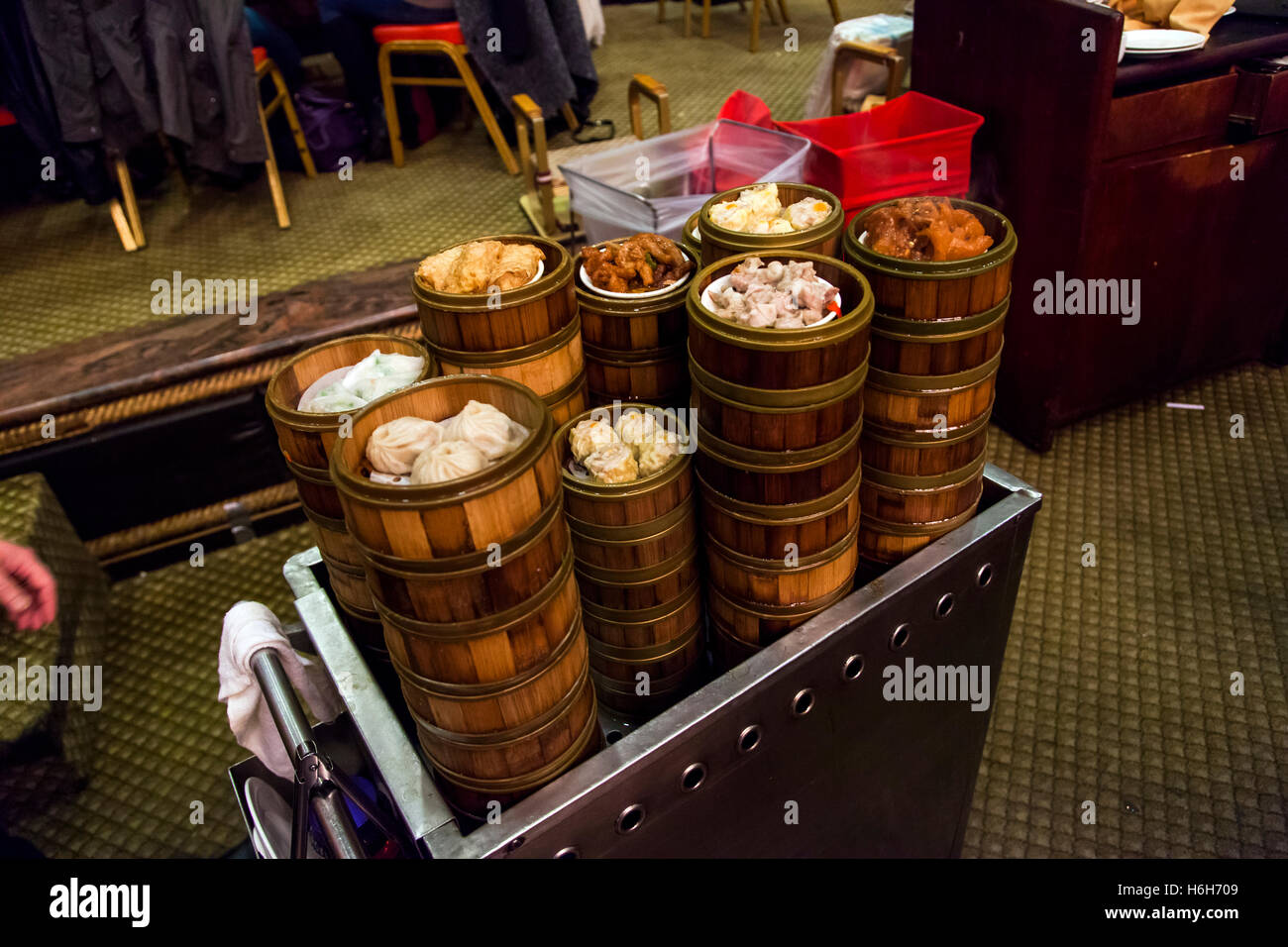 Stacks of Chinese food dishes on a cart in a traditional Chinese ...