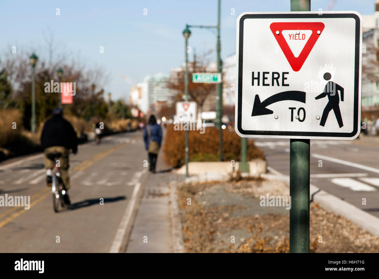 Sign pointing pedestrians where to go Stock Photo - Alamy