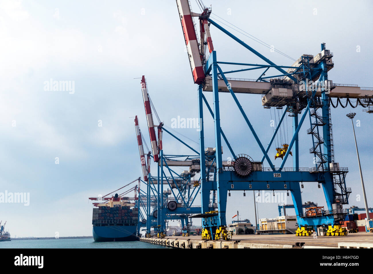 View of a freighter ship docking in a commercial harbor Stock Photo - Alamy