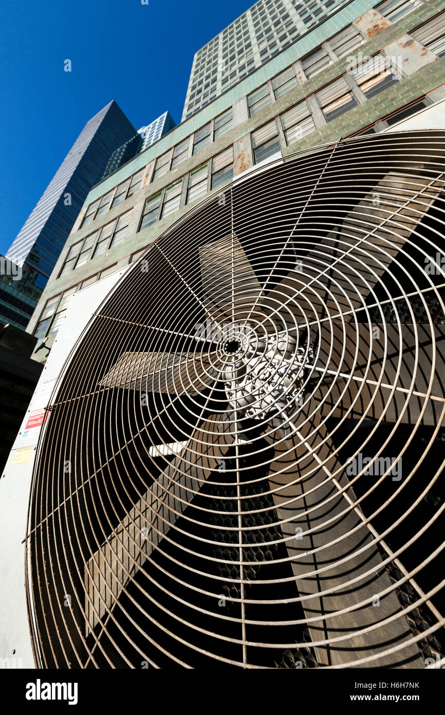 Wide angle view of an outdoor HVAC air conditioner unit located on a ...