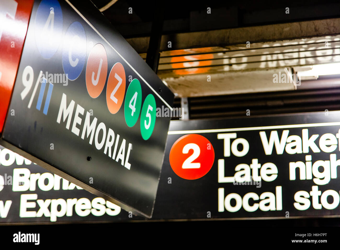 Sign in a New-York subway station marking the way to various lines and ...