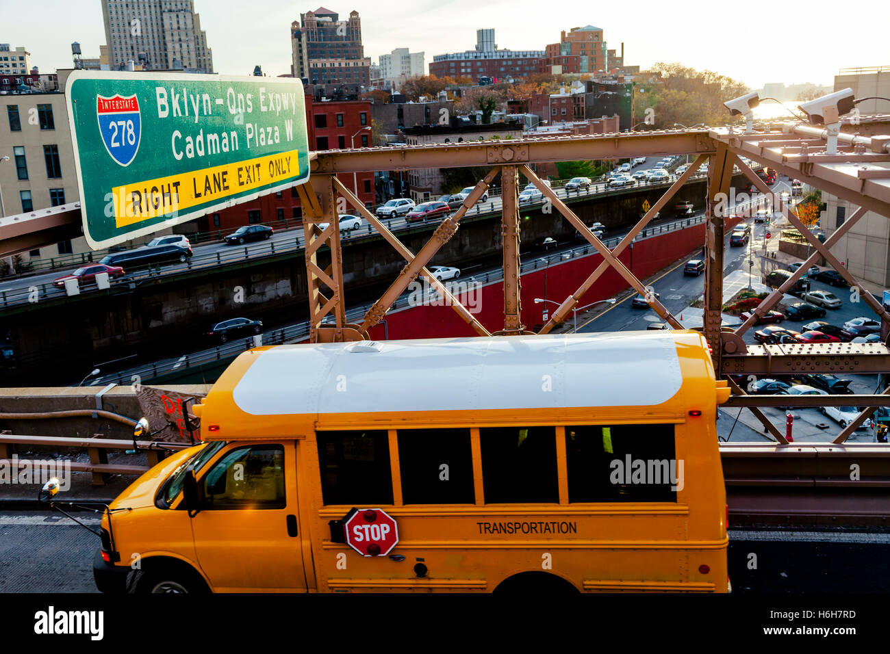 Sign above a highway depicting the way to the Brooklyn-Queens ...