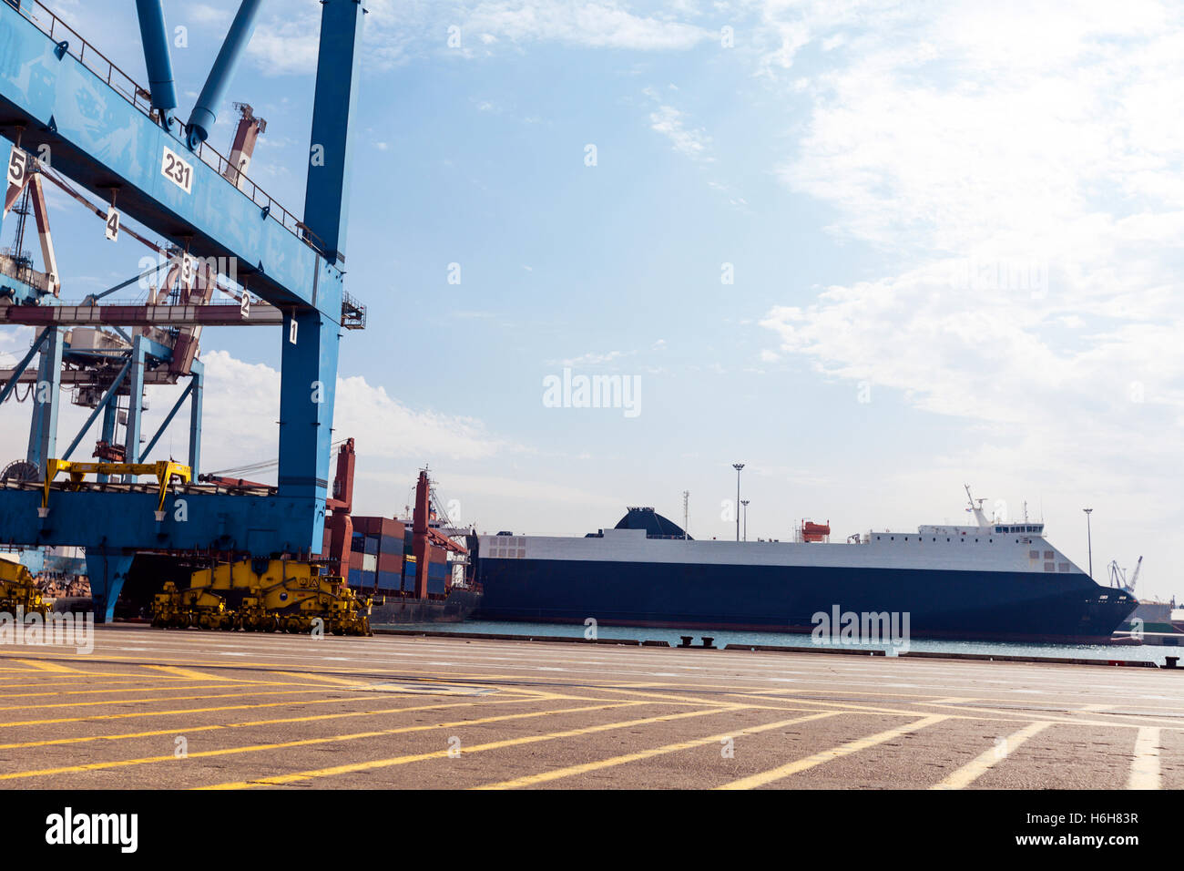 View of a freighter ship docking in a commercial harbor Stock Photo - Alamy