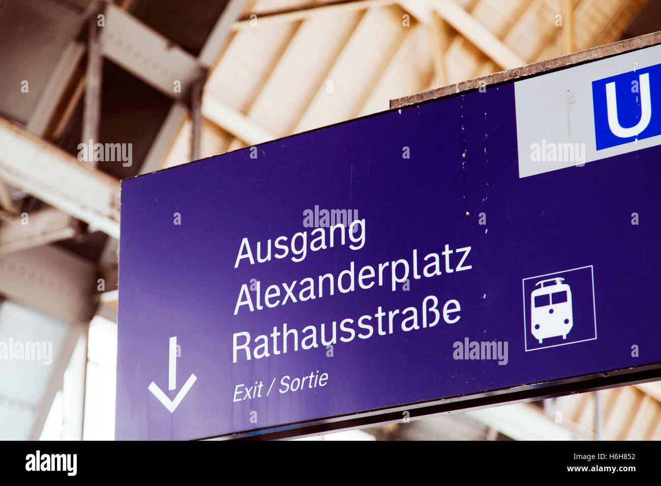 Train station sign depicting the exit in the direction to ...