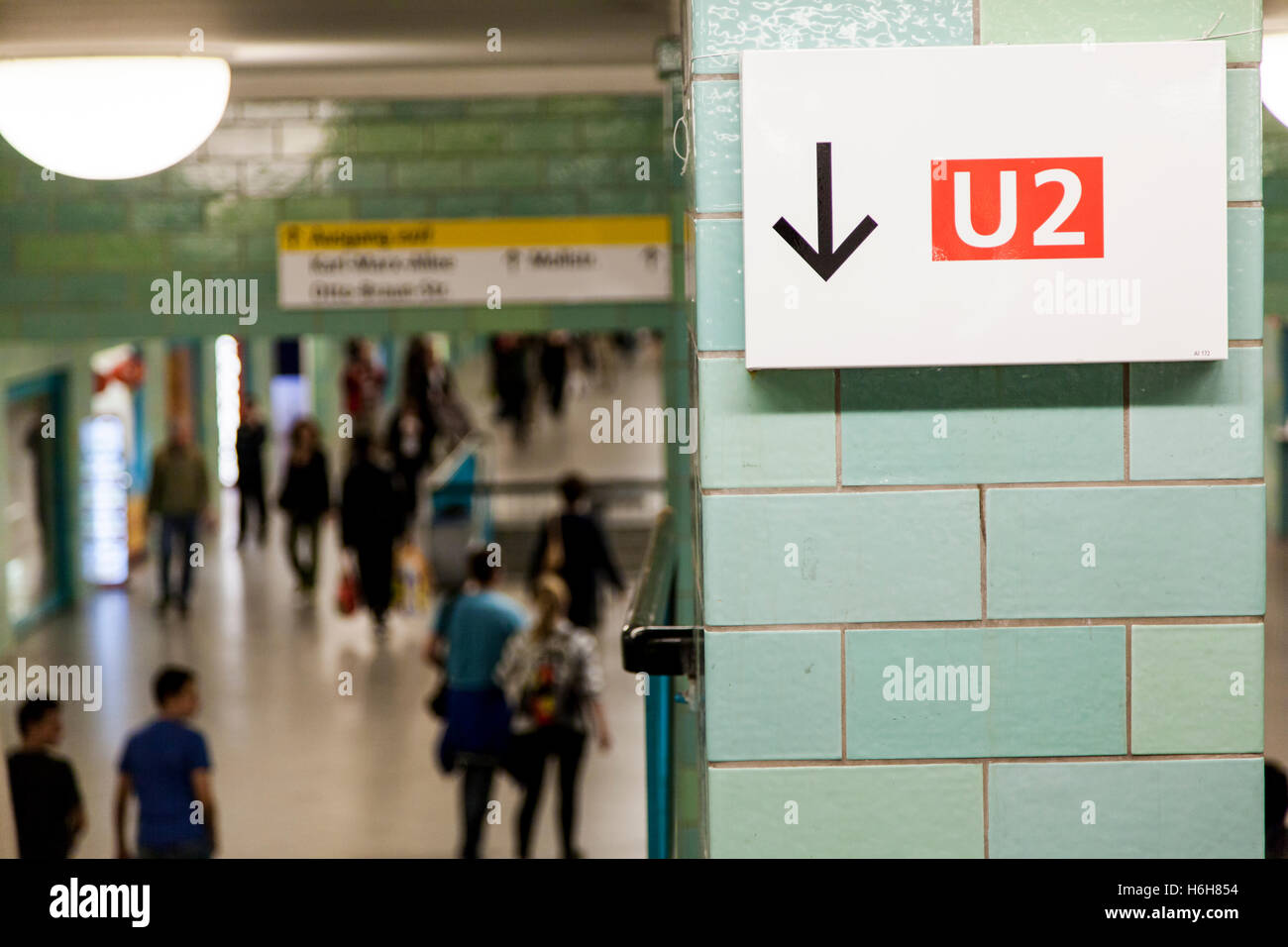 A sign showing the way to the U2 U-bahn train in a busy station in ...
