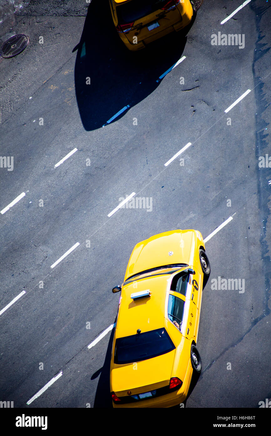 High angle view of yellow taxi on a New-York street on a sunny day ...