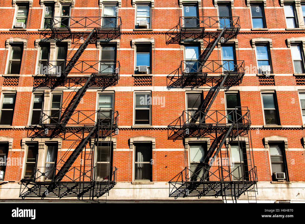 The exterior of a red stone residential building in Manhattan Stock ...