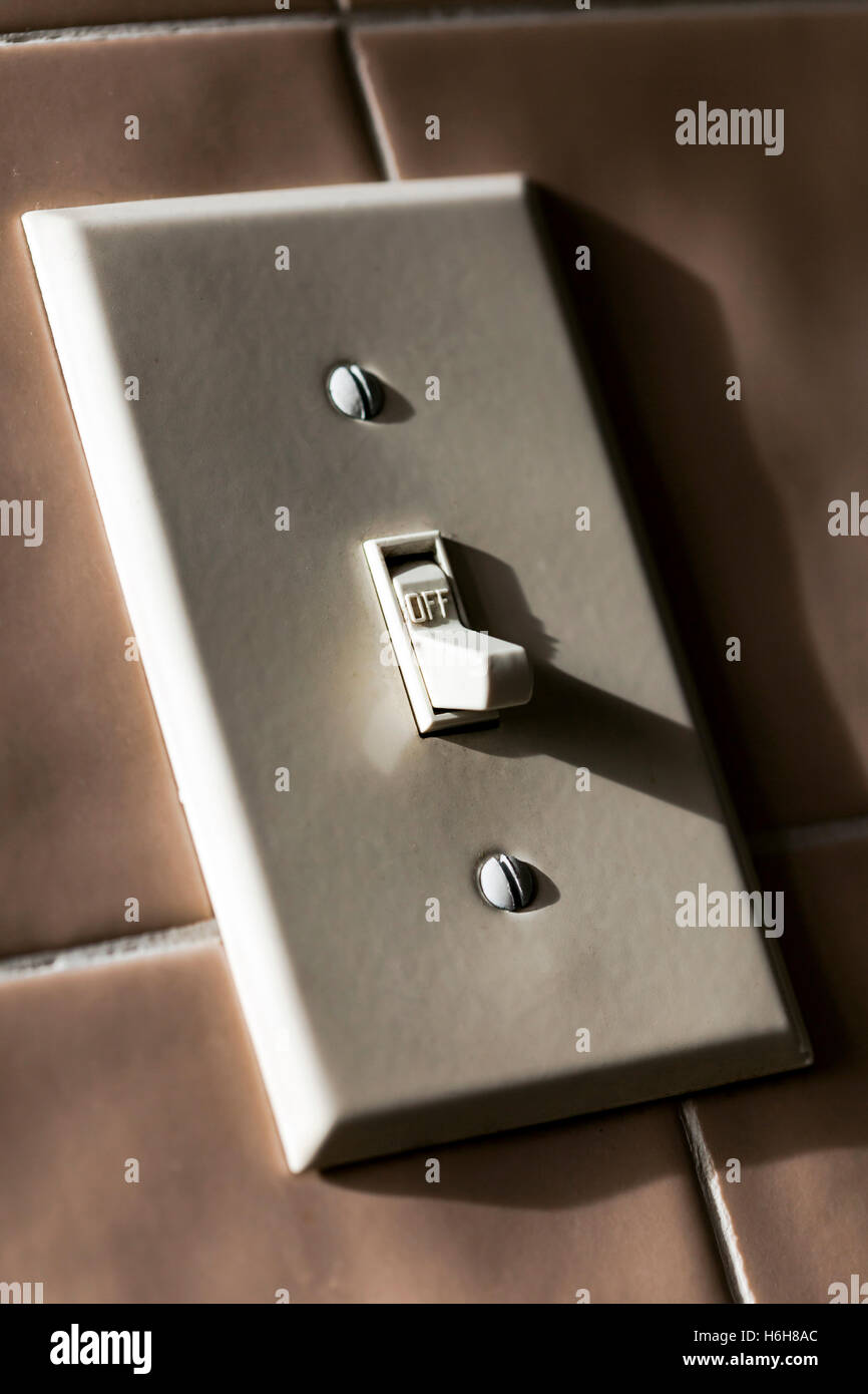 Light switch on tile ceramics wall turned off Stock Photo - Alamy