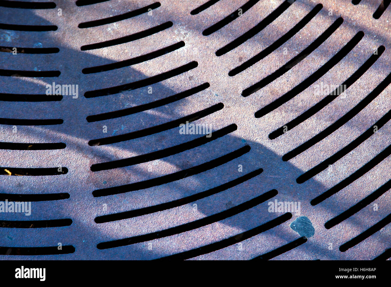 Abstract view of a circular rusty metal grate Stock Photo - Alamy