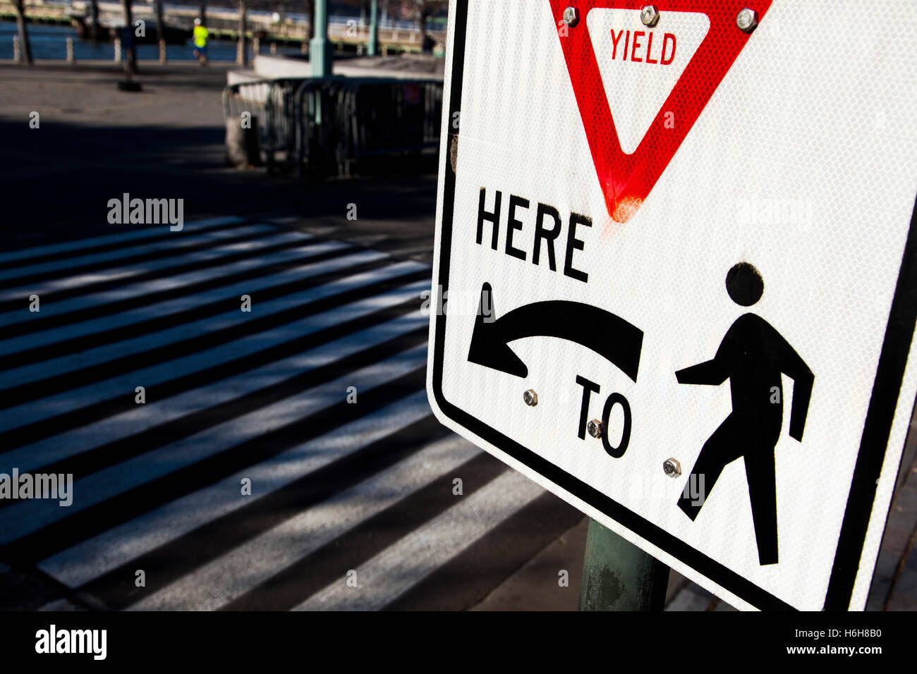 Sign pointing pedestrians where to go Stock Photo - Alamy