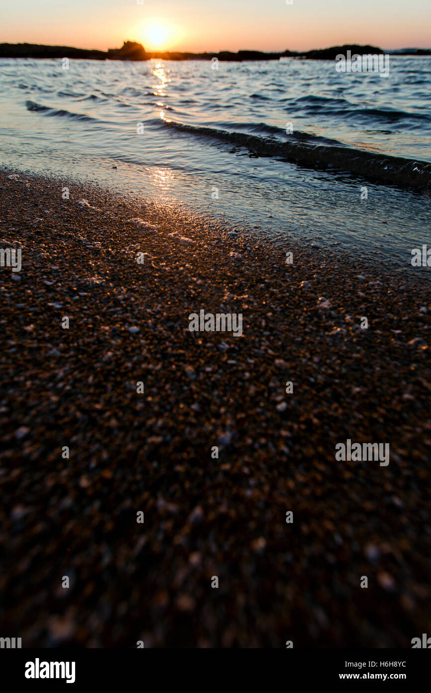 Evening light falling on the dark yellow sand at the beach Stock Photo ...