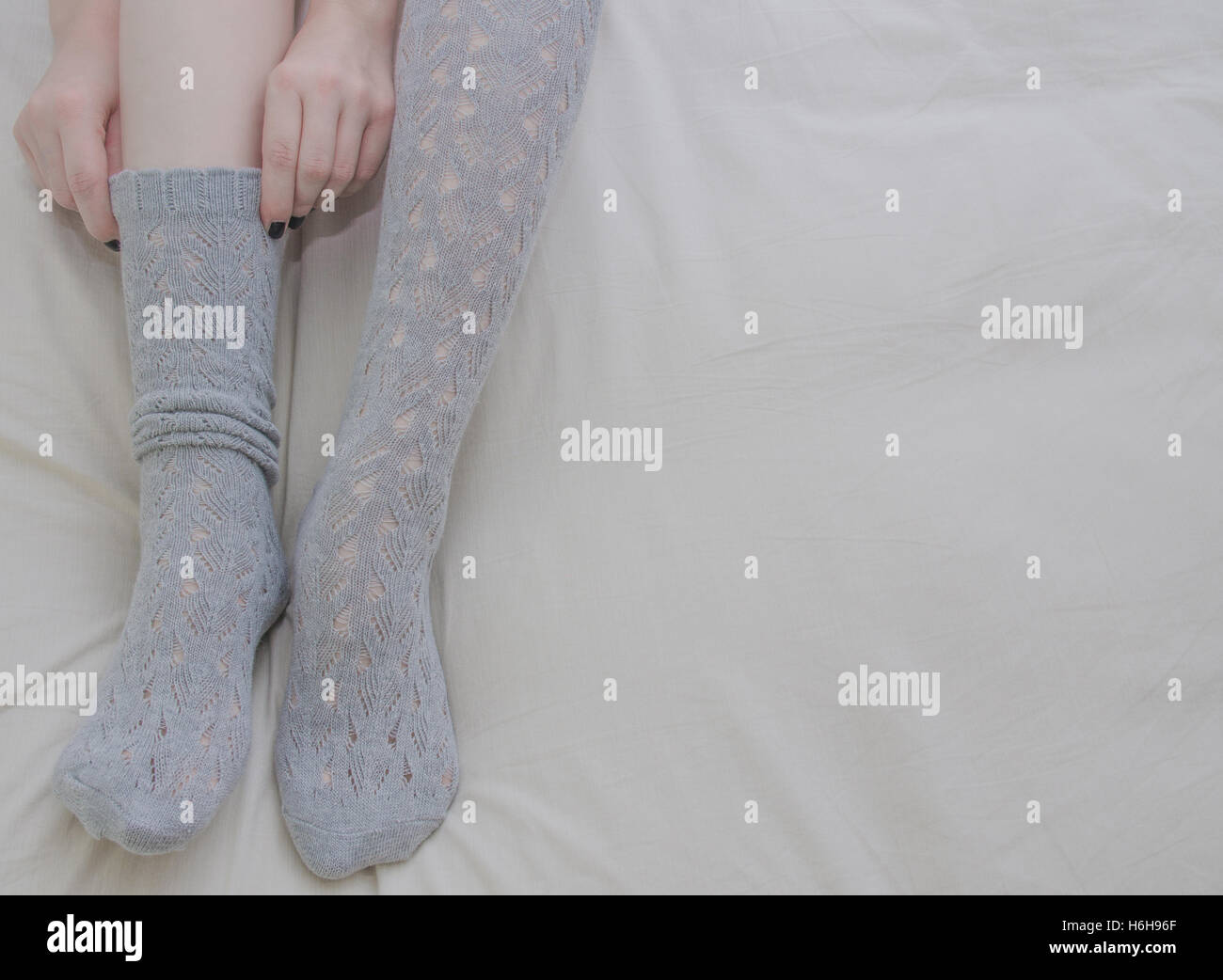 Girl putting socks hi-res stock photography and images - Alamy