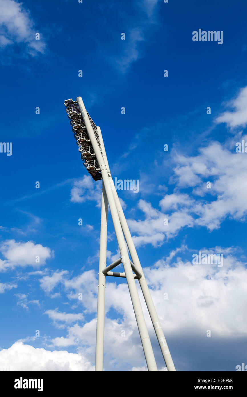 Stadium lighting tower and cloudy sky on a sunny day Stock Photo - Alamy