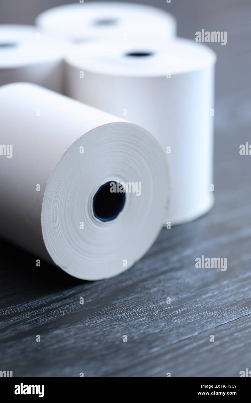 Set of white paper rolls on dark background Stock Photo - Alamy